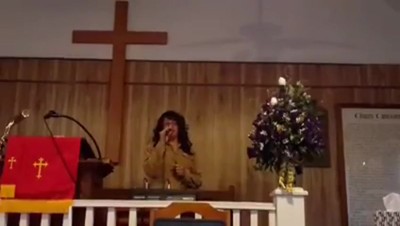 Angelia Moore singing "His Eye Is On The Sparrow"